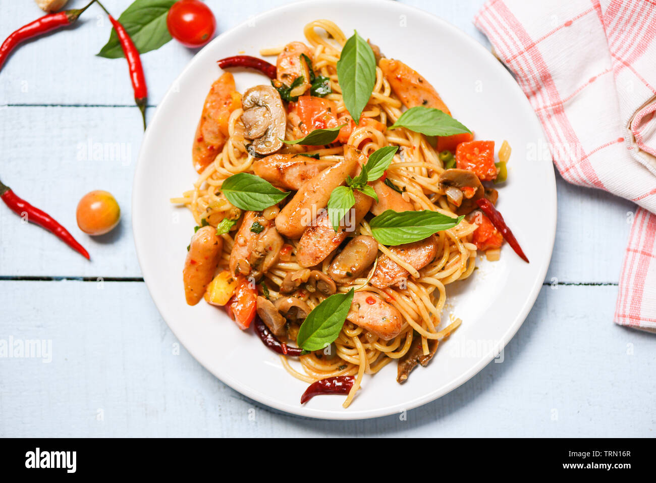 Hot and spicy Spaghetti Pasta tomato chilli and basil leaves top view ...