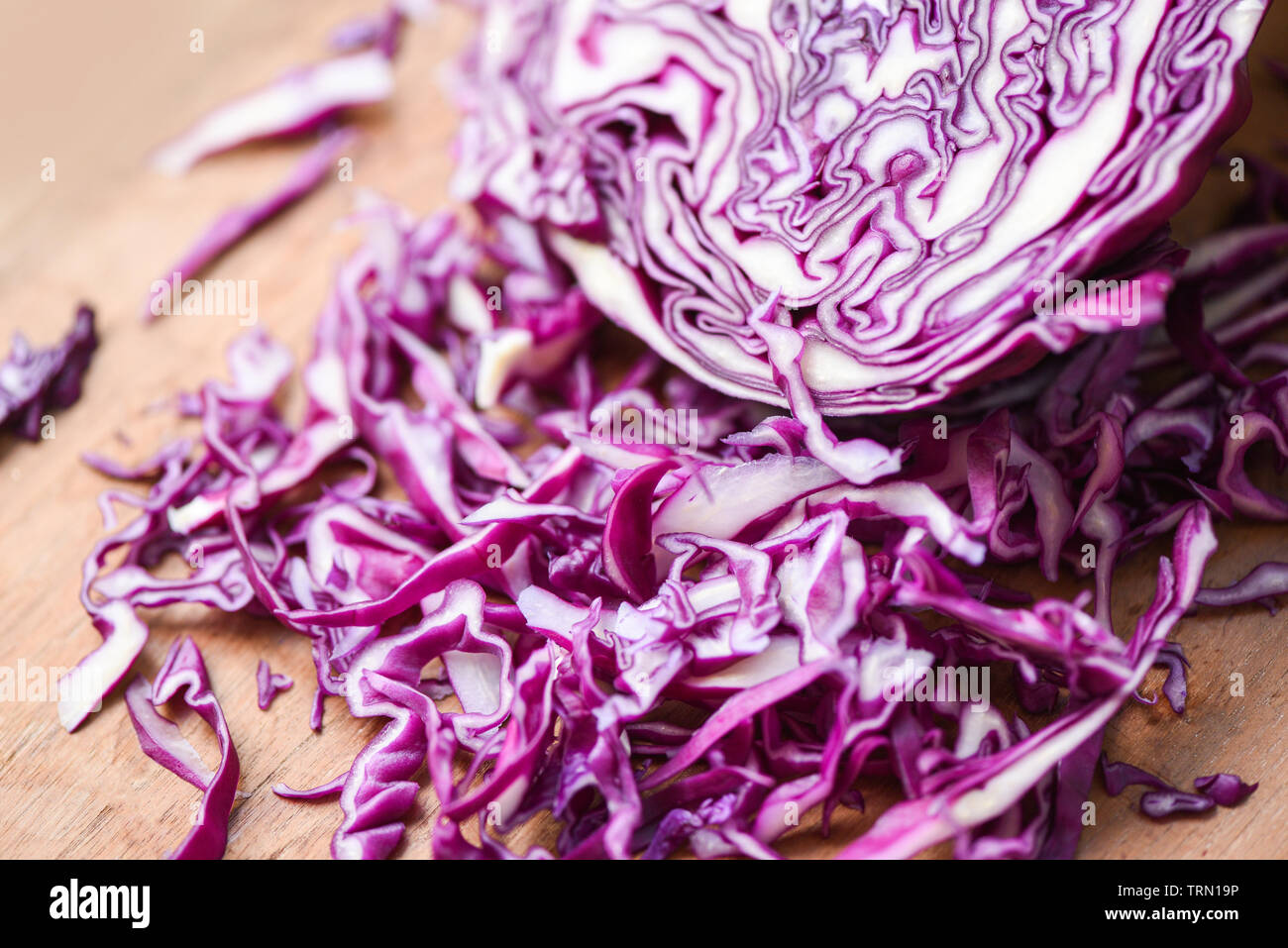 Cabbage purple / Shredded red cabbage slice in a wooden cutting board ...
