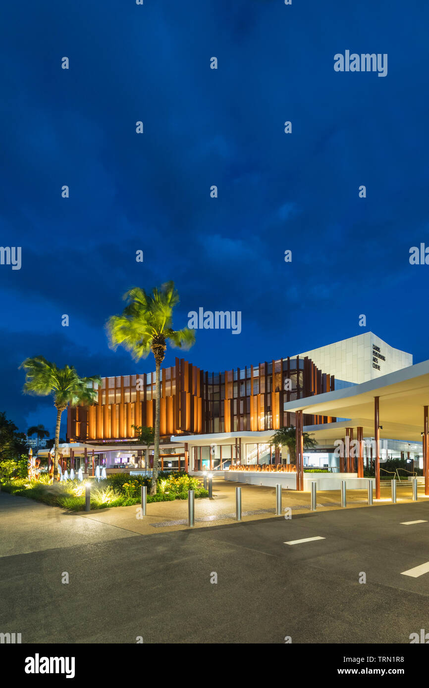 Entrance to the Cairns Performing Arts Centre illuminated at twilight ...