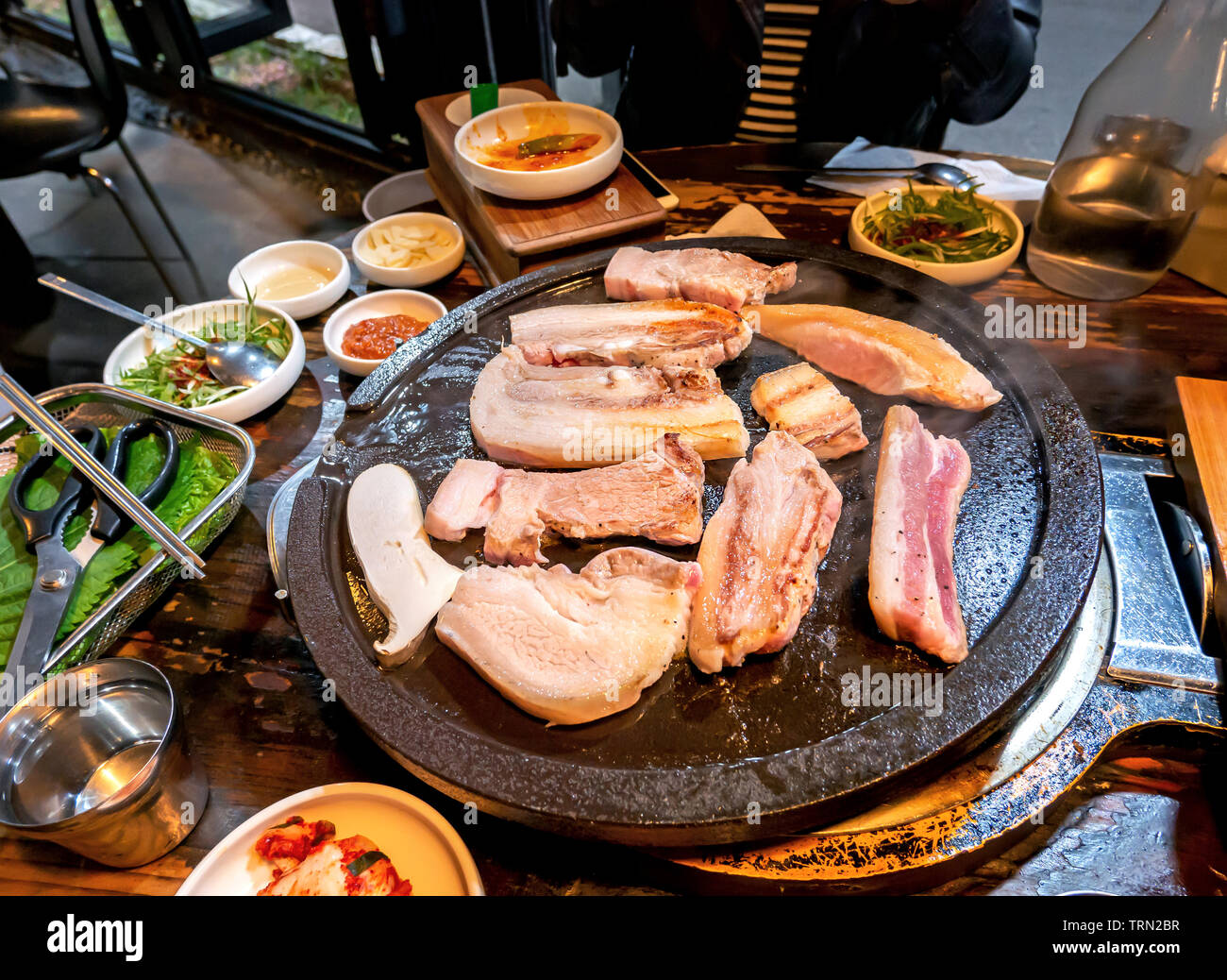 Pan-fried cooked black pork meal in Korea restaurant, fresh delicious ...