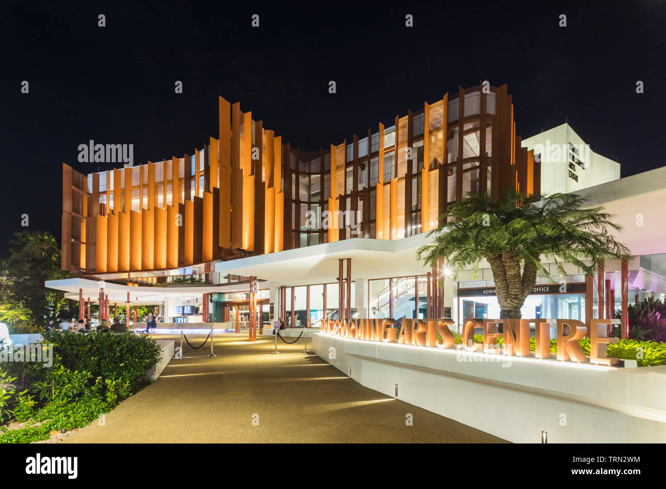 The entrance to the Cairns Performing Arts Centre illuminated at night ...