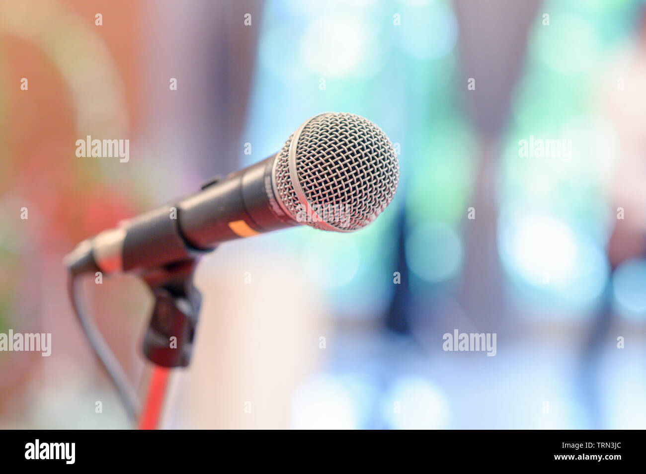 communication microphone on stage against a background of auditorium ...