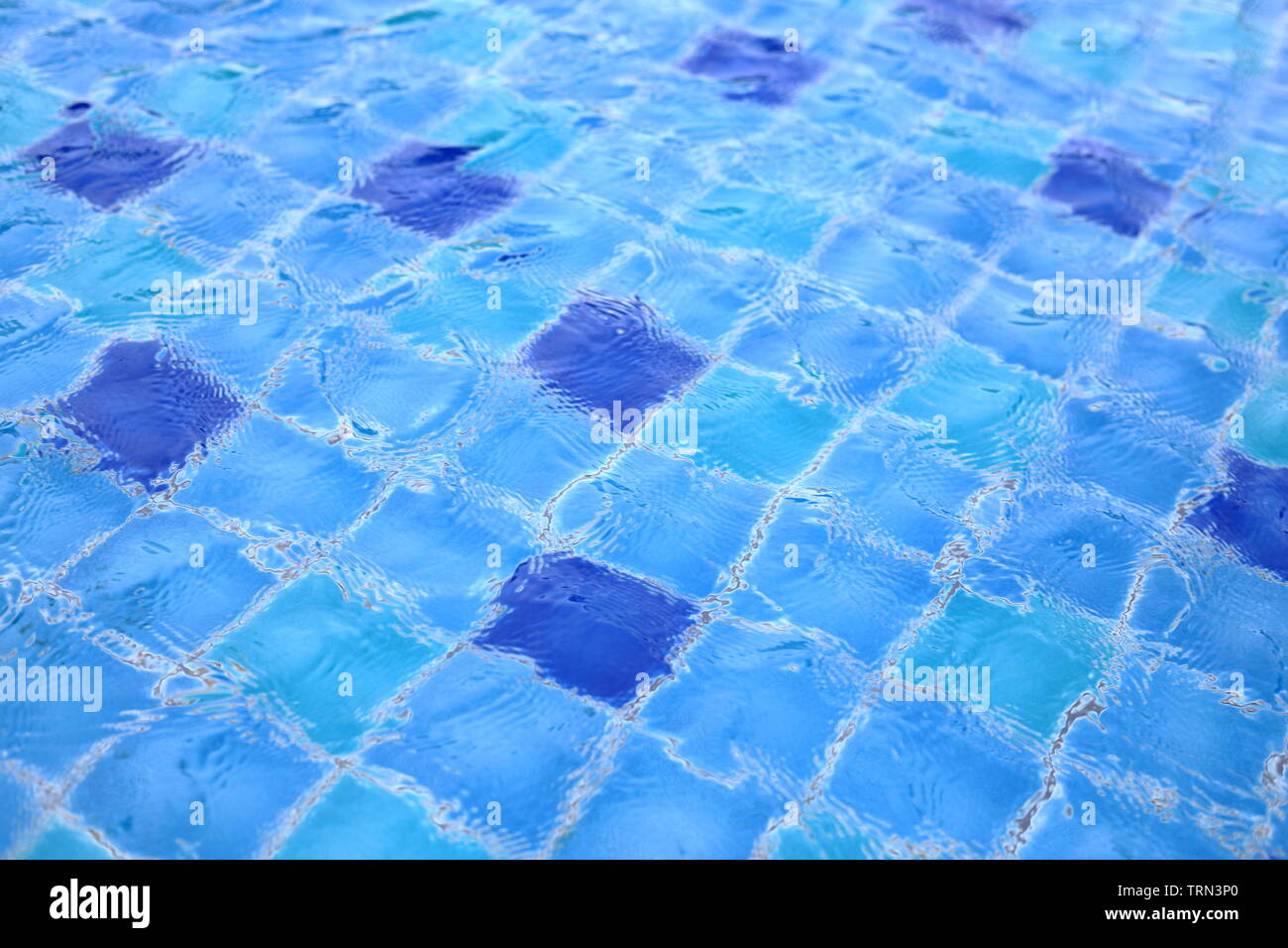 wave of swimming pool water surface. open water body blown by strong ...