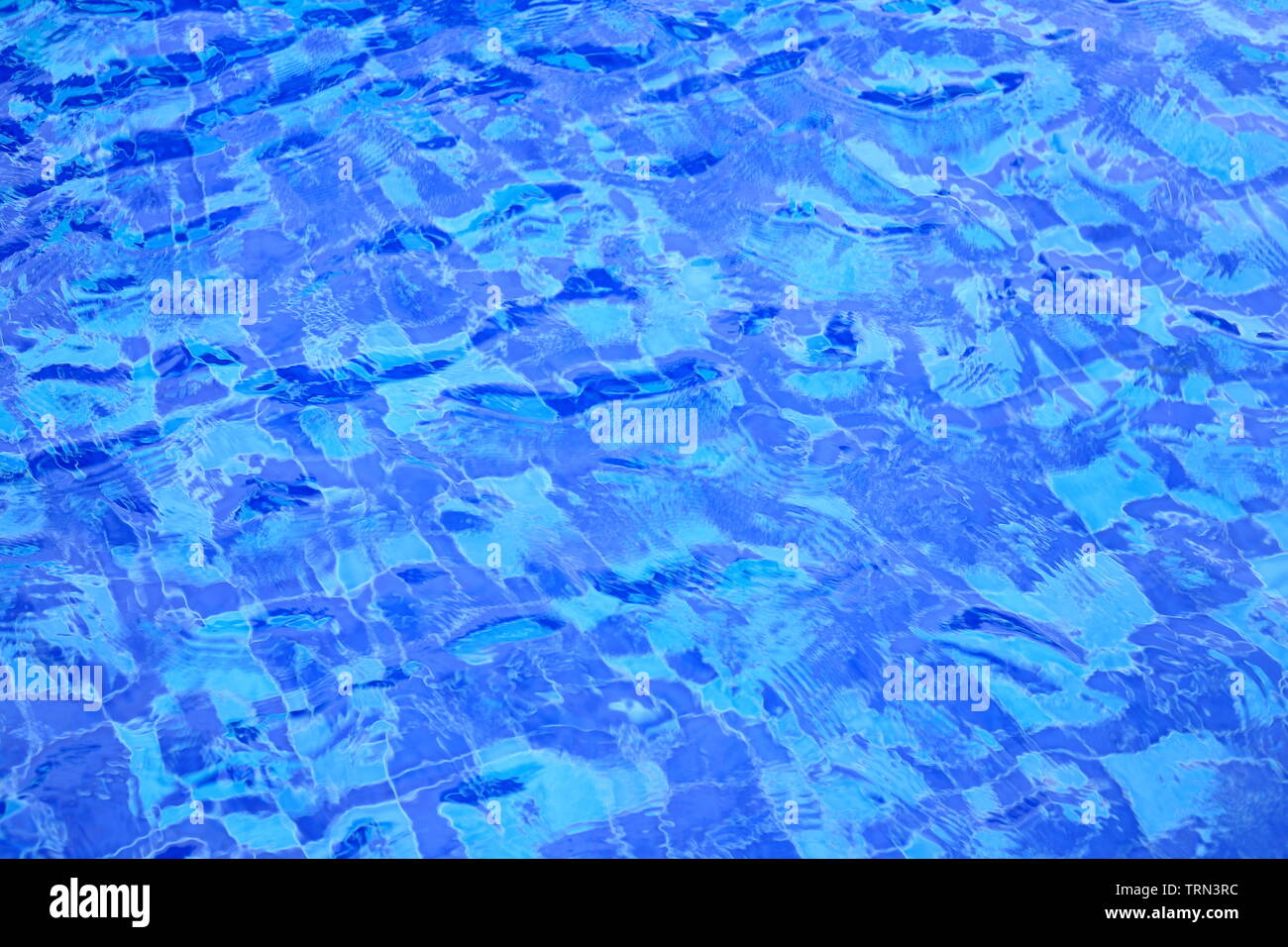 wave of swimming pool water surface. open water body blown by strong ...