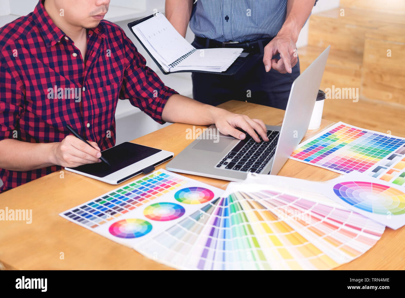 team Web designer working drawing something on graphic computer in the ...