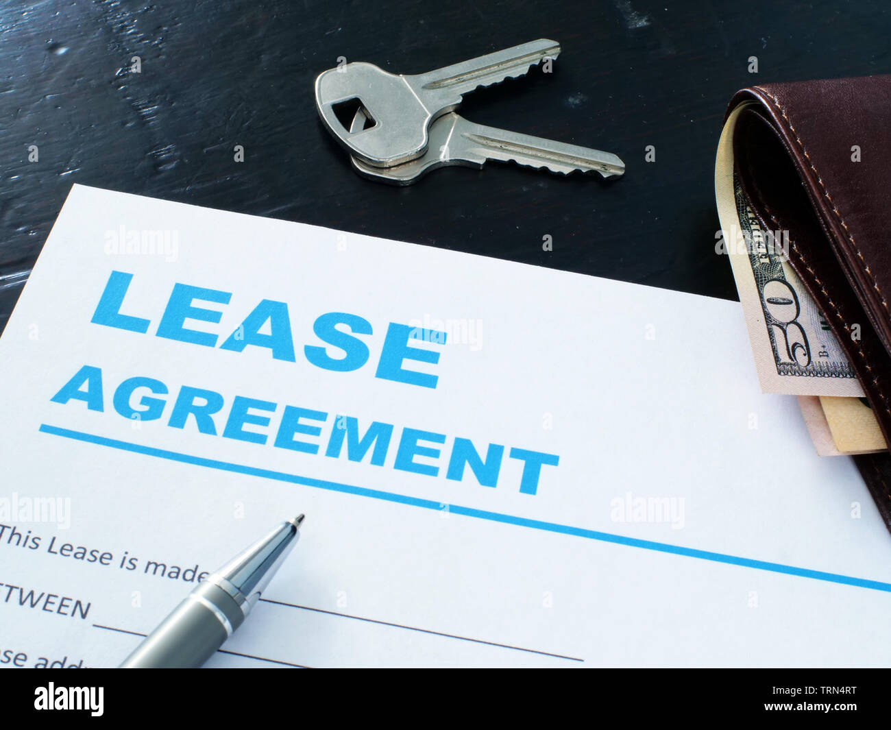 Lease agreement form, pen and house keys Stock Photo - Alamy