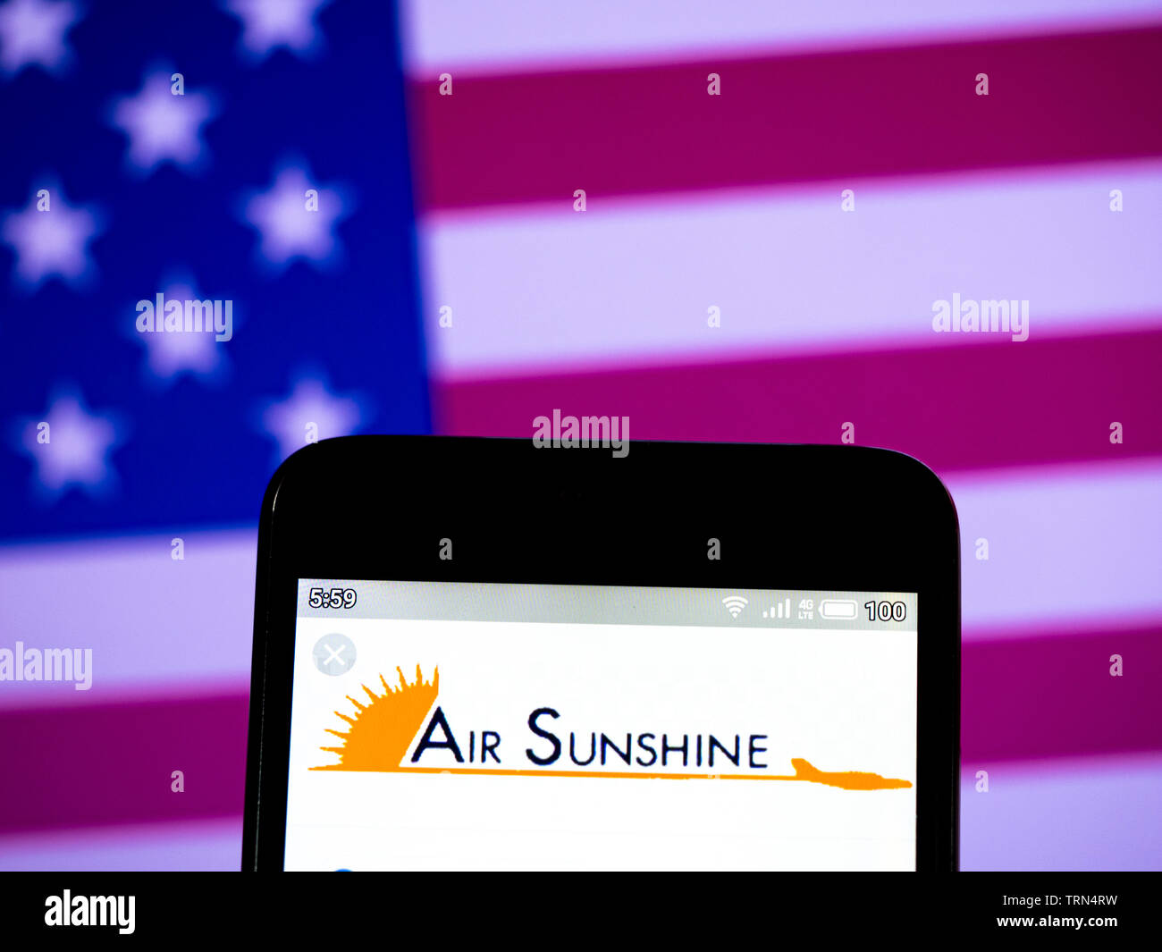 In this photo illustration the Air Sunshine logo is seen displayed on a ...