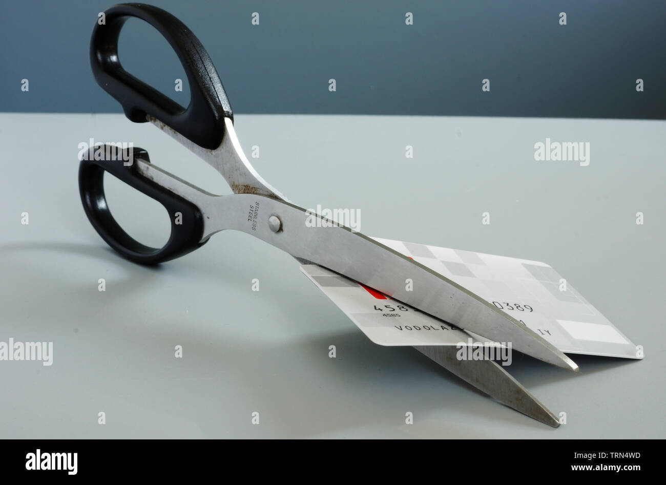 Scissors and cut credit card. Debt free Stock Photo - Alamy