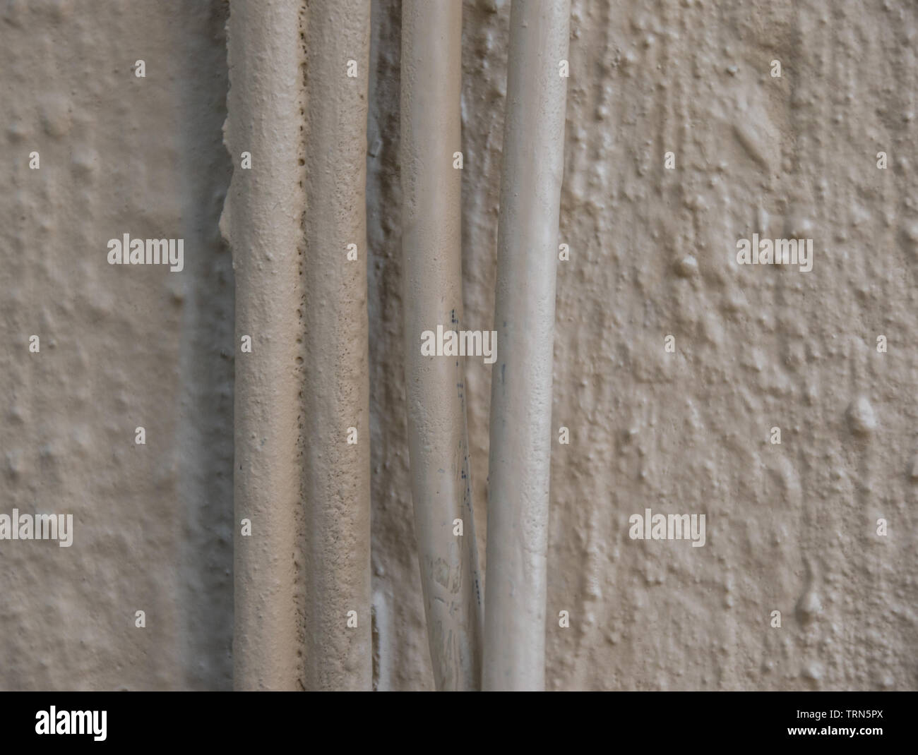 Network cabling down the side of a building up close and isolated image ...