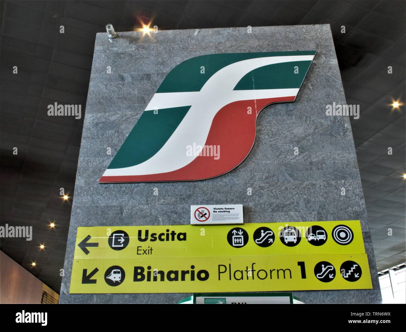 Logo of the italian railways on a wall of the Tiburtina railway station ...