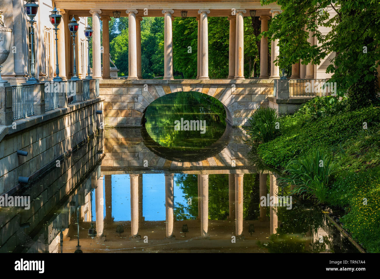 Lazienki Park in Warsaw, Poland, classical arch bridge with colonnade ...
