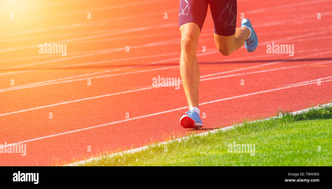 Athletics man running on the track field Stock Photo - Alamy