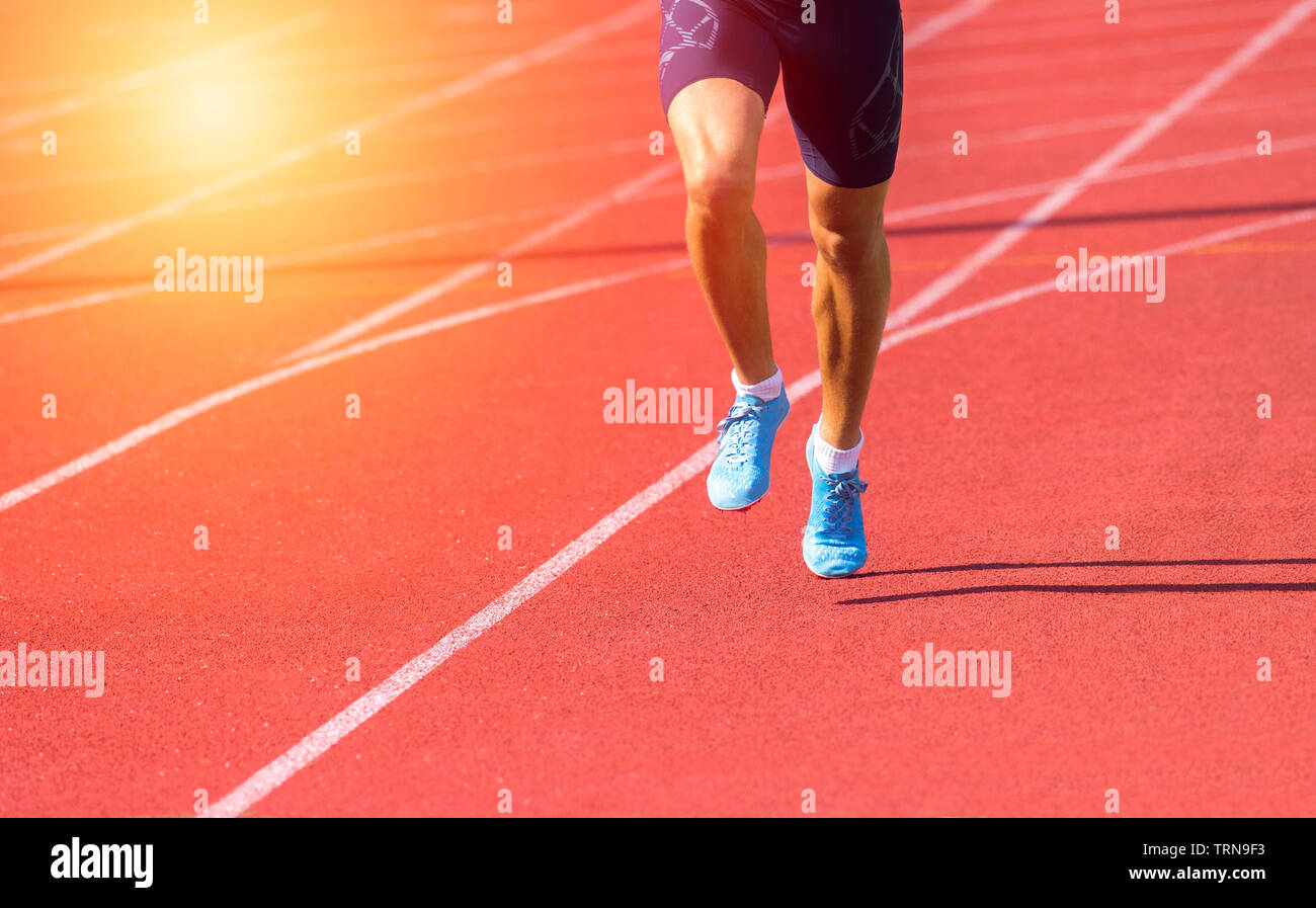 Athletics man running on the track field Stock Photo - Alamy