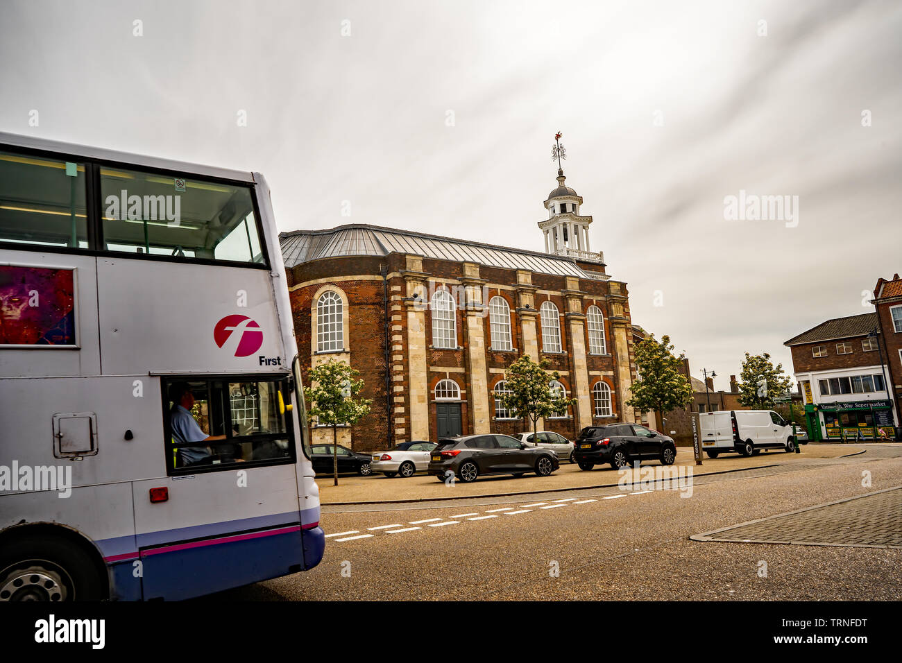 A First bus driving around the town hall in the seaside town of Great ...