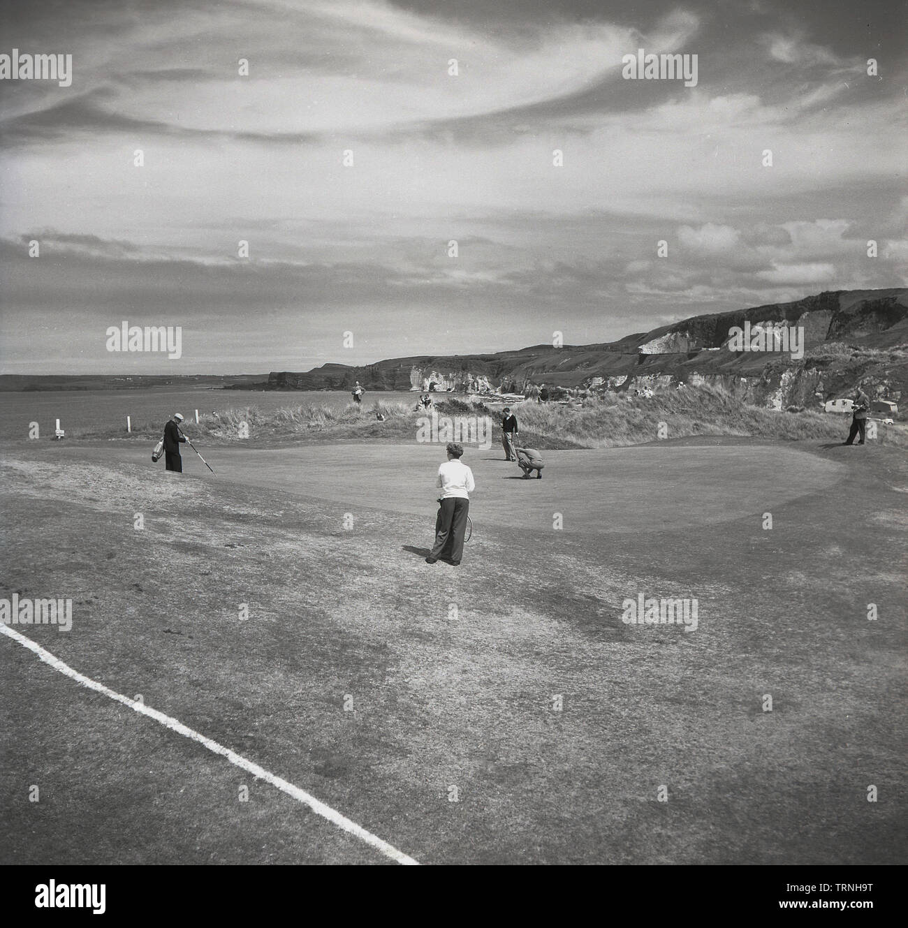 1950s, historical, amateur golfers playing golf at Royal Portrush Golf ...