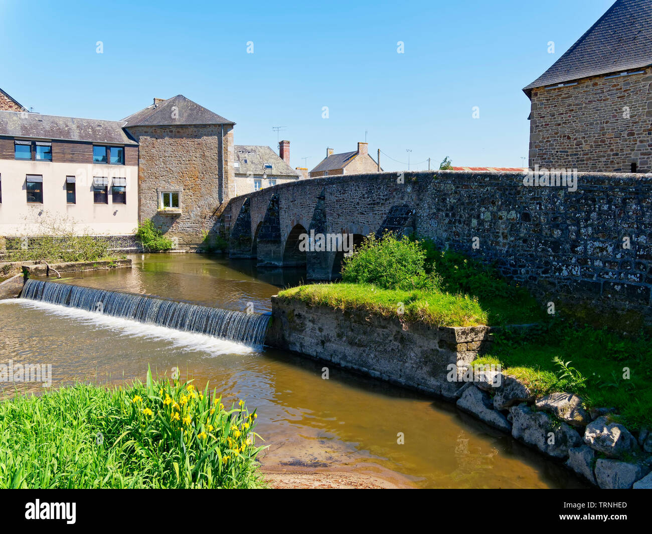The ancient stone bridge over the River Selune in Ducey-les-Cheris ...