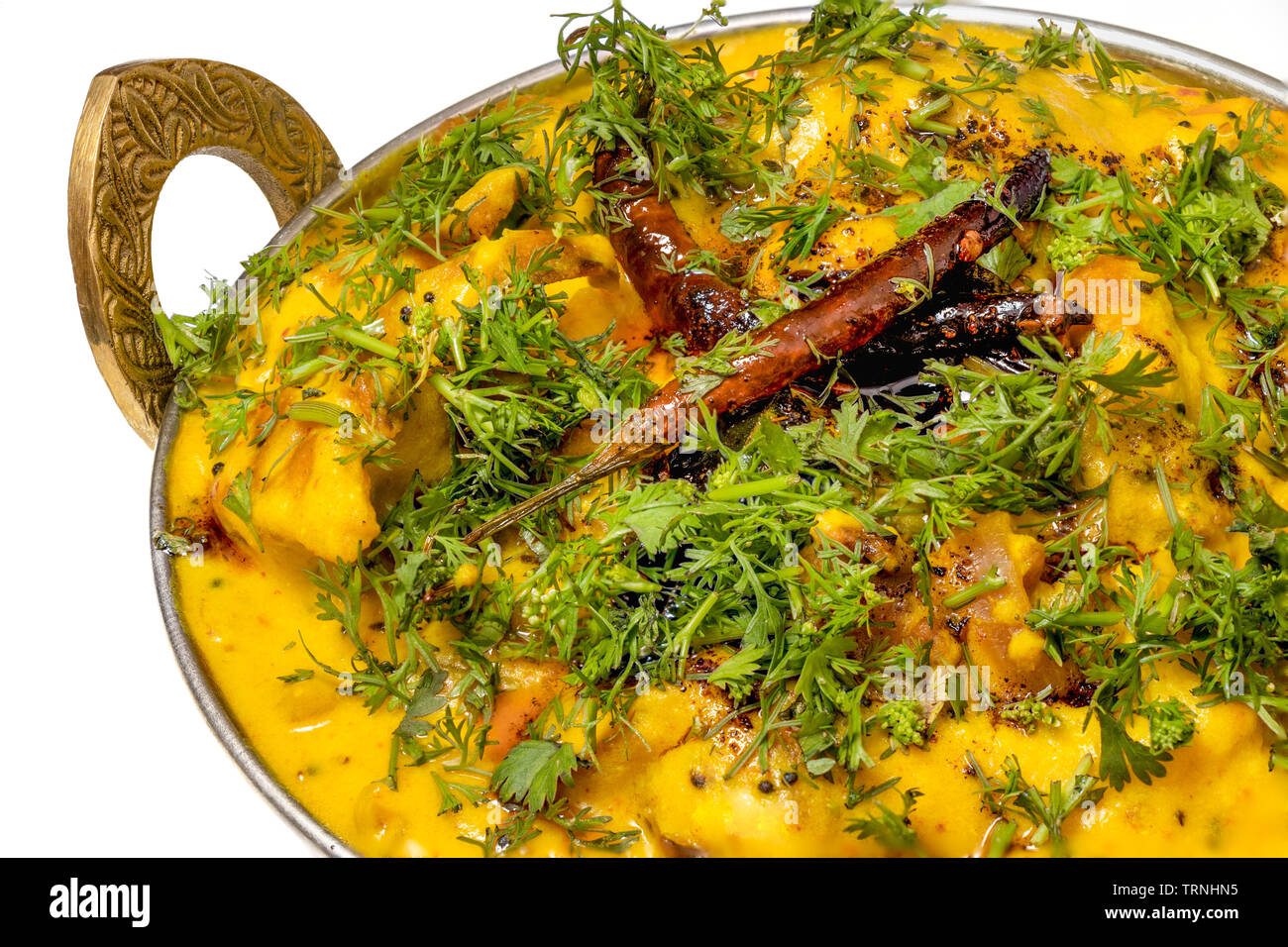 Kadhi Pakoda or pakora, Indian cuisine, served in a brass kadai or bowl ...