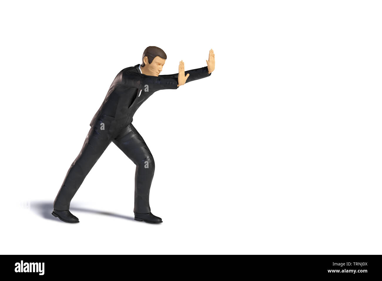 toy miniature businessman pushing, business figurine concept isolated ...