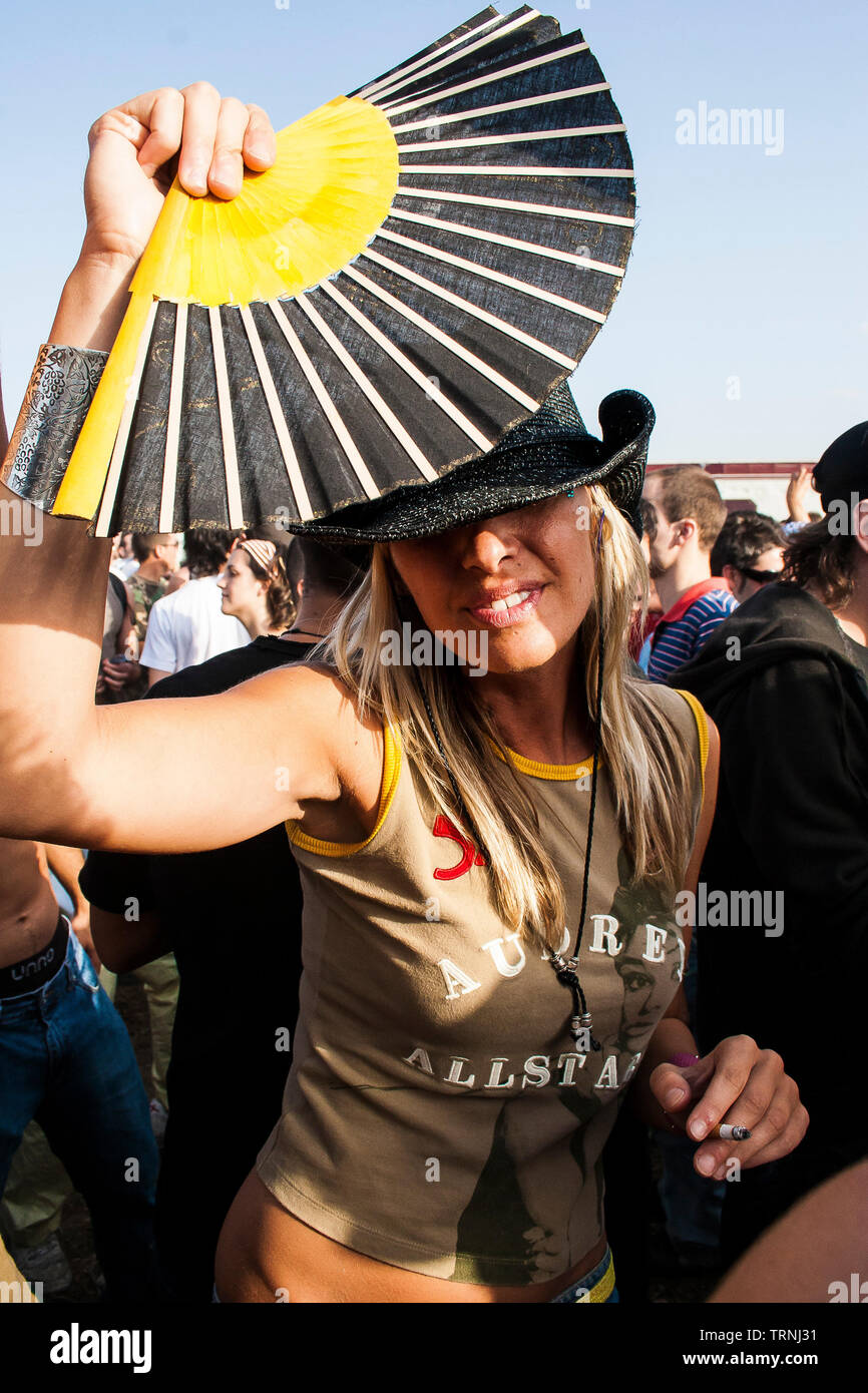 Pretty girl dancing with a fan at Anti-Sonar free illegal squat party ...