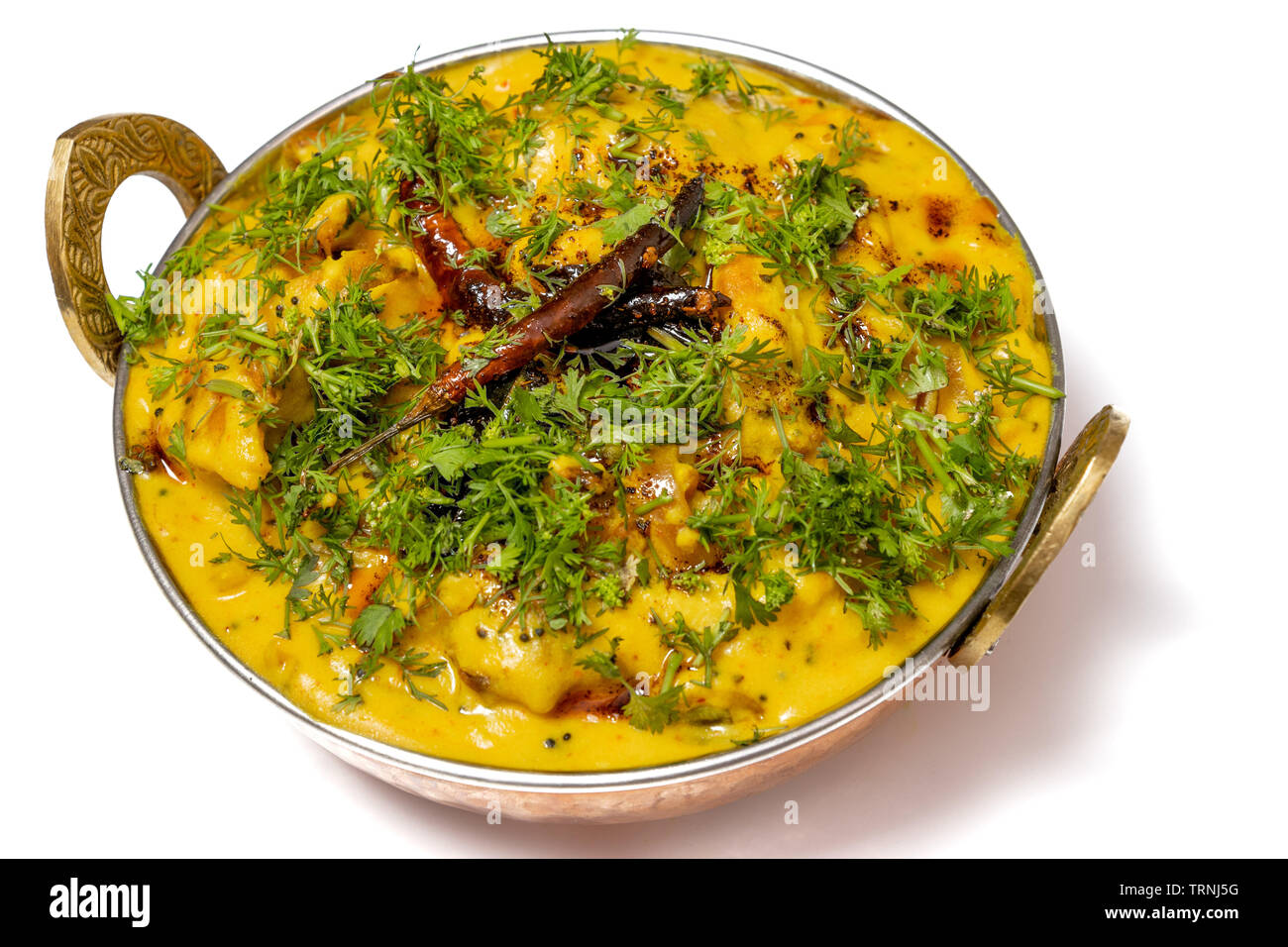 Kadhi Pakoda or pakora, Indian cuisine, served in a brass kadai or bowl ...
