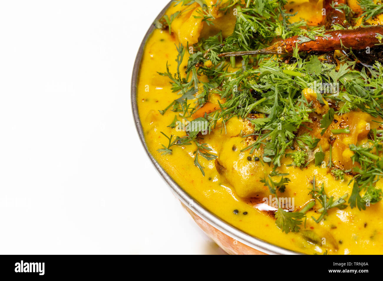 Kadhi Pakoda or pakora, Indian cuisine, served in a brass kadai or bowl ...
