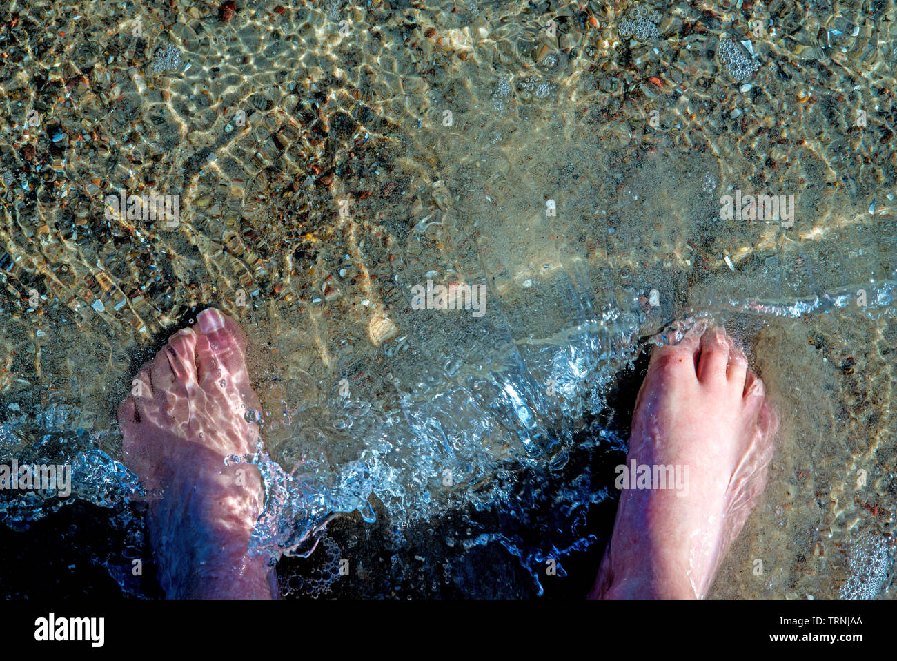 Feet in the sea hi-res stock photography and images - Alamy