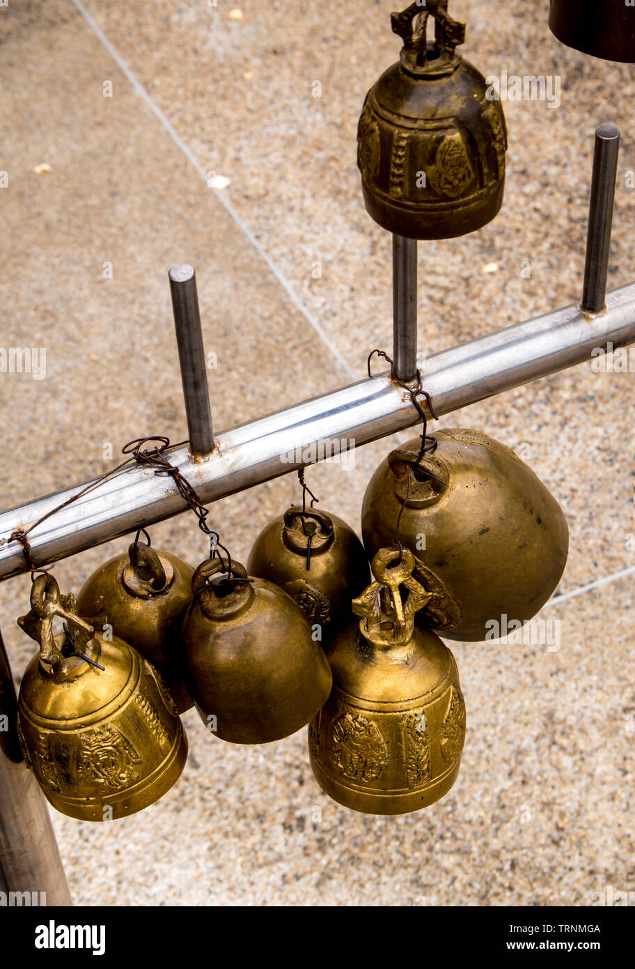 Bunch of small brass bell in the temple Stock Photo - Alamy