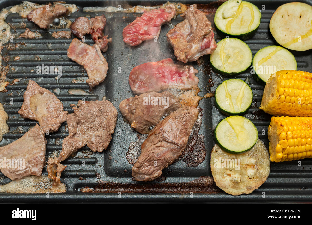 veal and vegetables raclette Stock Photo - Alamy