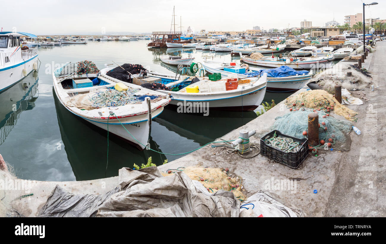 Boats and fishing nets in Tyre harbour in early morning, Tyre, Lebanon ...