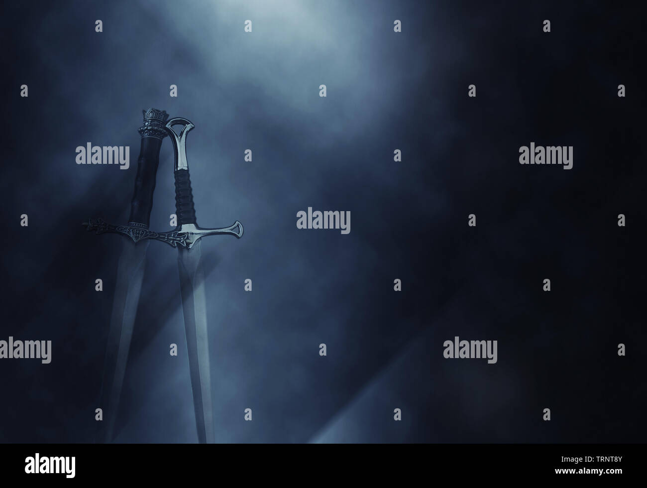 mysterious and magical photo of silver sword over gothic black ...