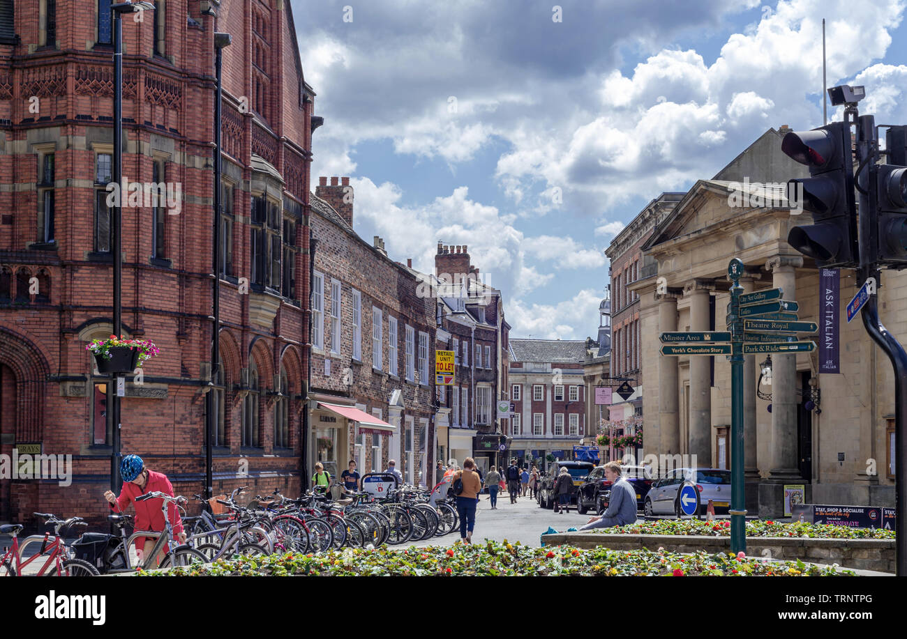 Blake Street in York. There is a flower bed and a traffic light in the ...