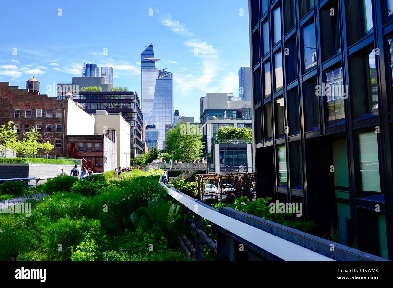 Skyline with people as seen from the public park, converted rail linear ...