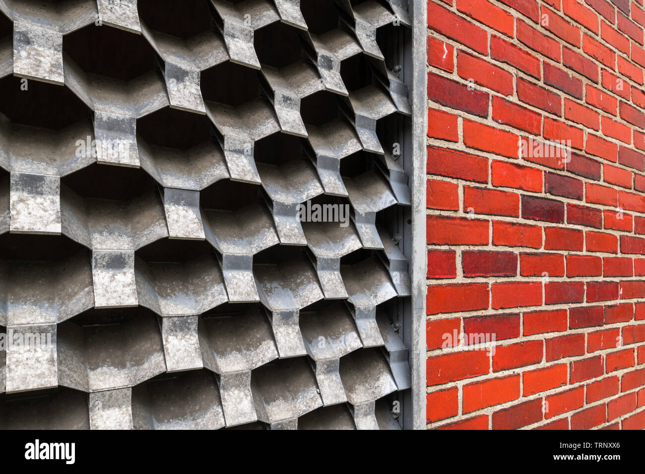 Detail of red glazed brick and vent at Sandburg Village Stock Photo - Alamy