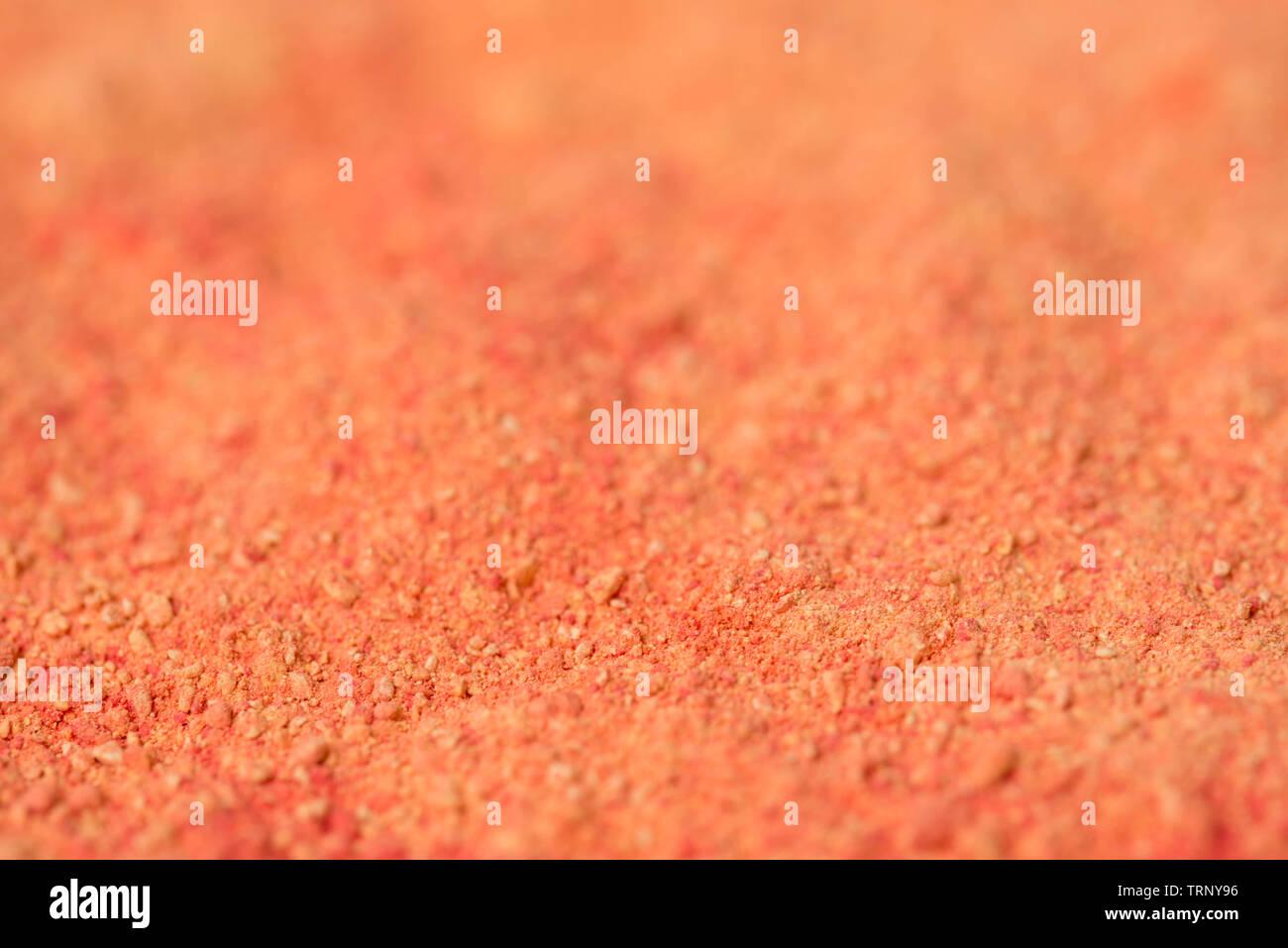 orange powder pigment art texture background macro Stock Photo - Alamy