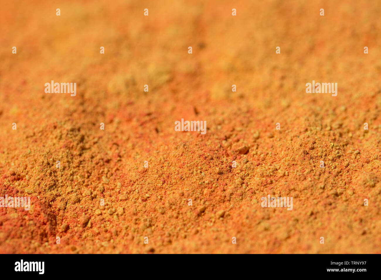 orange powder pigment art texture background macro Stock Photo - Alamy