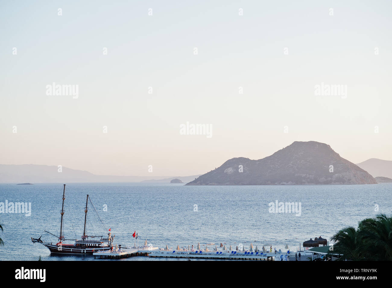 Aerial view of wooden pier with harbor, pirate tourist ship and marina ...