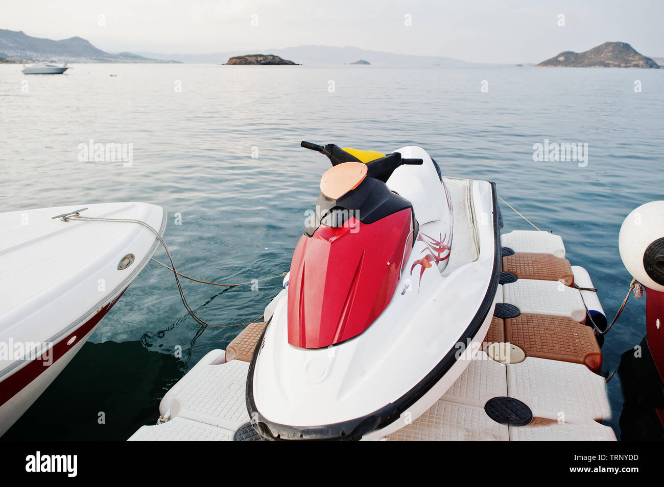 Red and whithe jet ski on a calm blue sea of Bodrum, Turkey Stock Photo ...