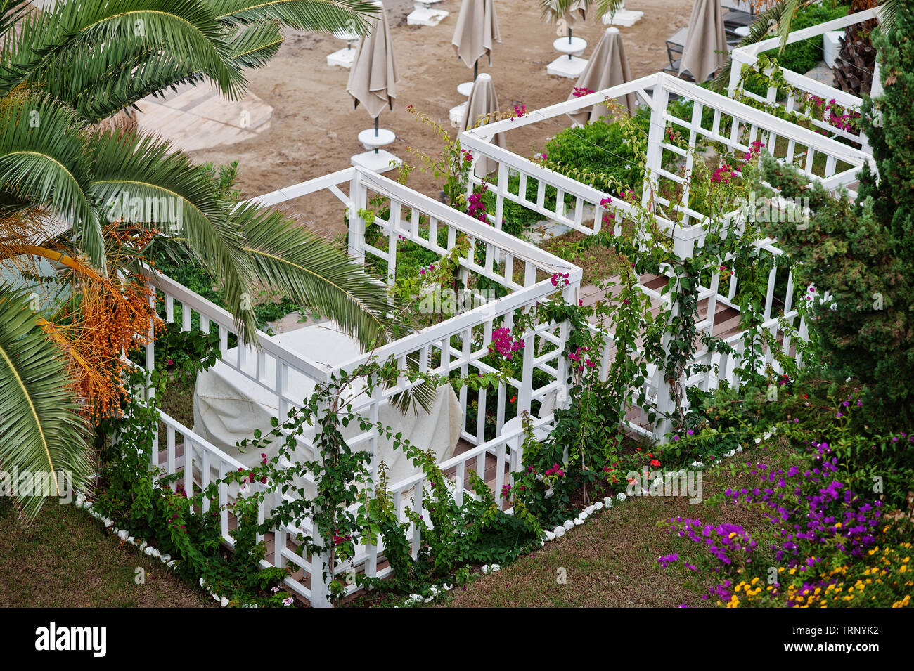 White cabanas with sun umbrellas. Popular landmark, famous destination ...