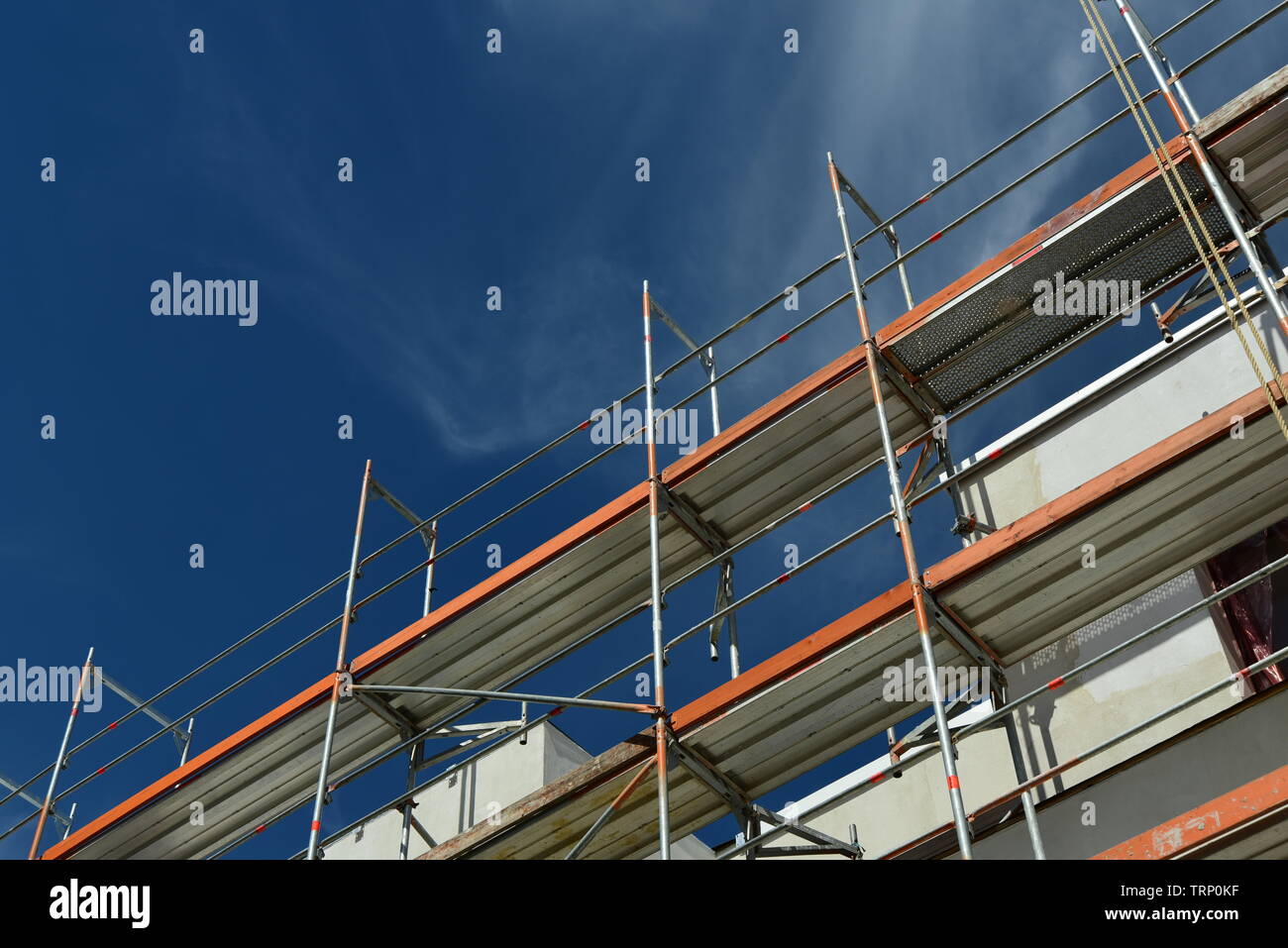 scaffolding on building against blue sky at a construction site Stock ...