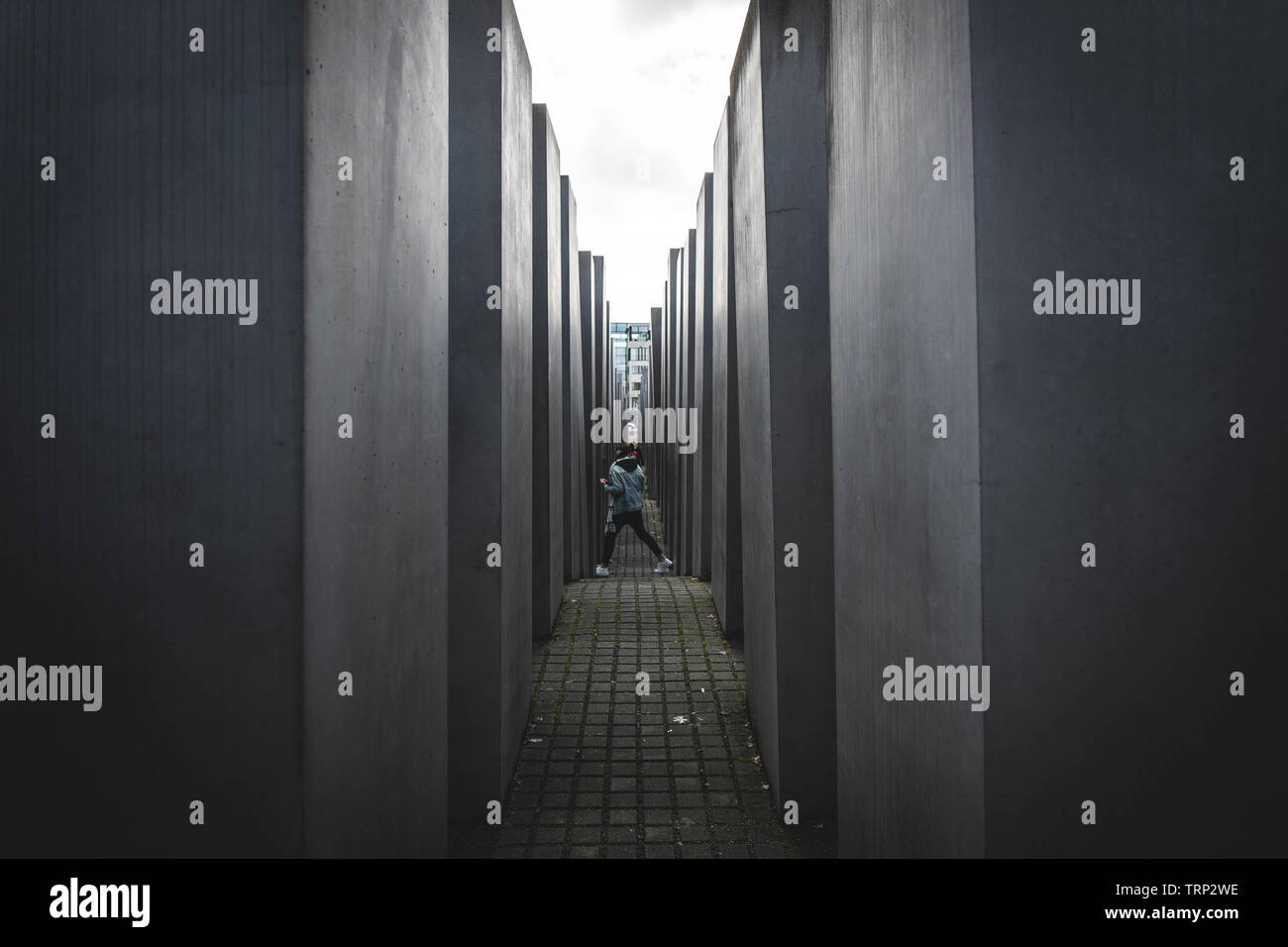 Person walking between barriers hi-res stock photography and images - Alamy