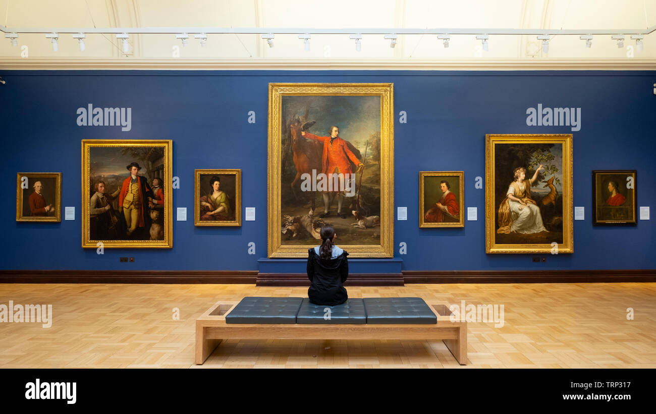Visitor Looking At Paintings Inside Scottish National Portrait Gallery