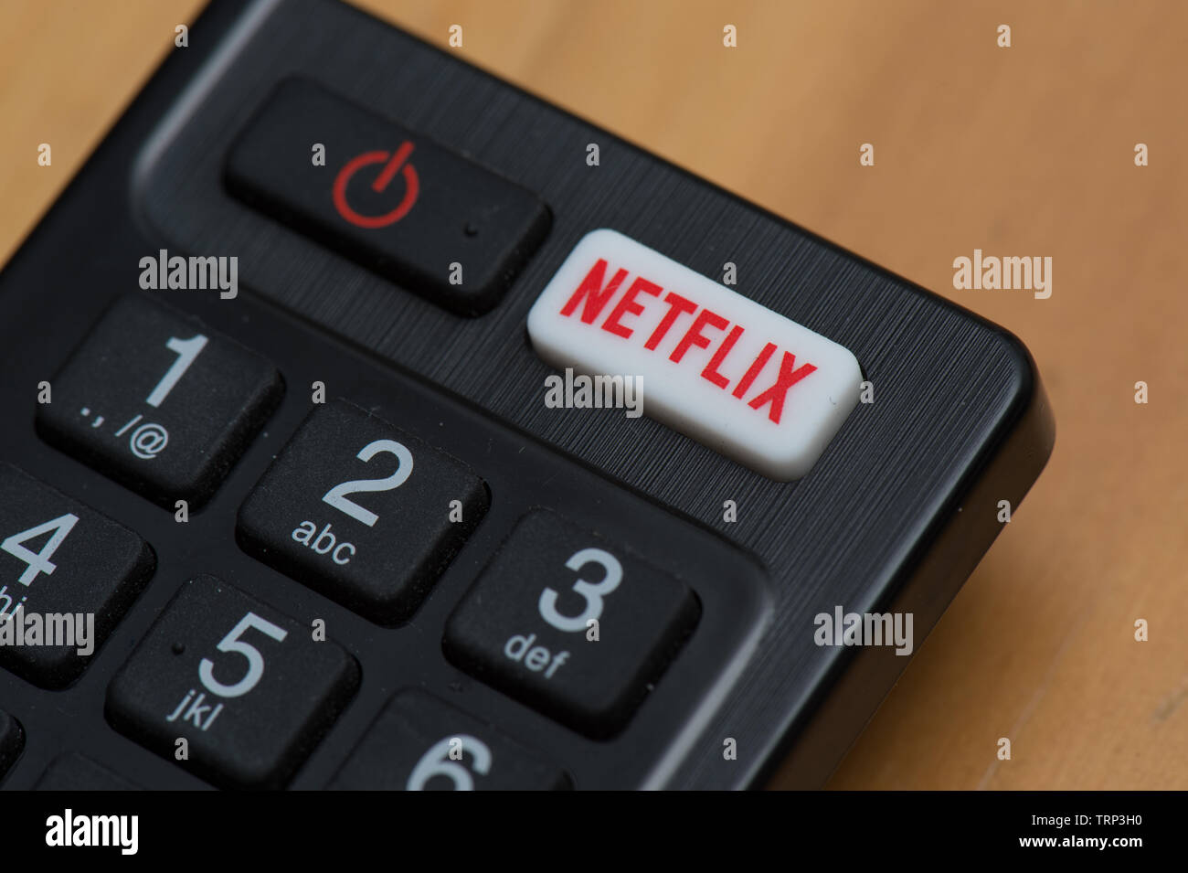 Close up of the Netflix logo on a remote control for a television Stock ...
