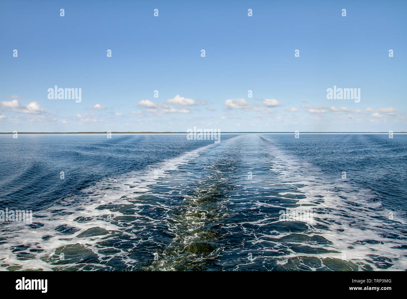 Waves from the boat on the surface of the White sea. Russia Stock Photo ...