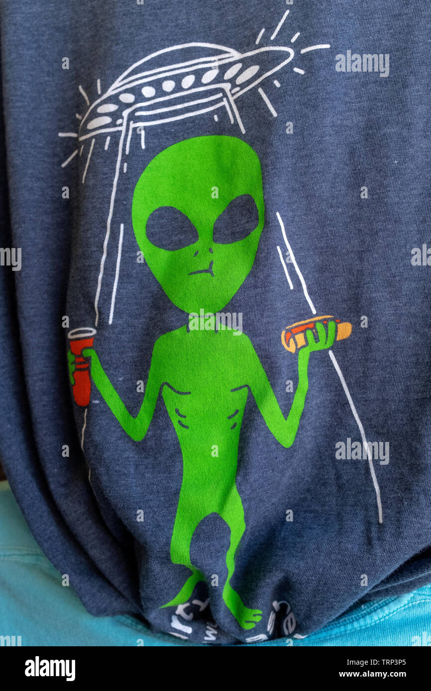 T-shirt with alien holding beer & frankfurter Stock Photo - Alamy