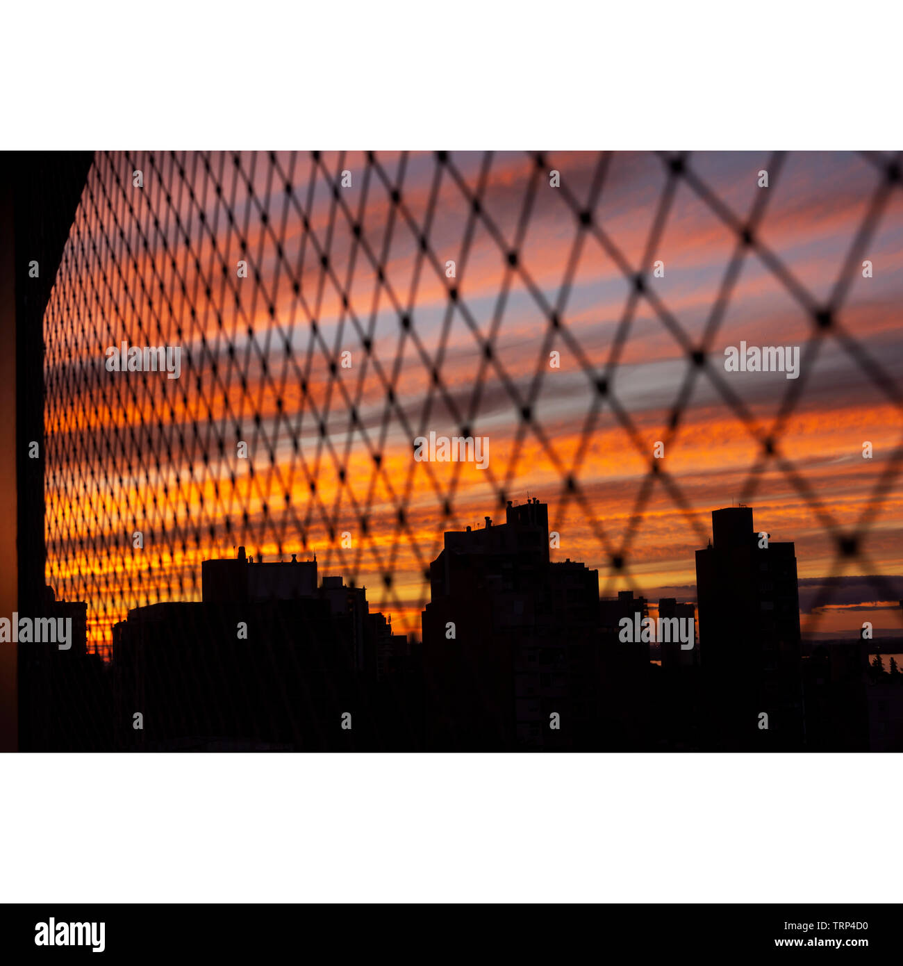 Dramatic sunset sky from behind the safety net from a balcony Stock ...