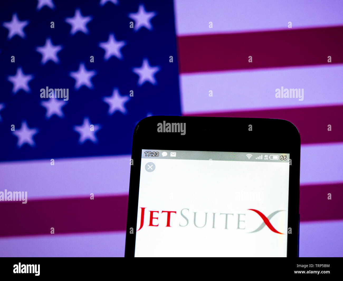 In this photo illustration the JetSuiteX logo is seen displayed on a ...