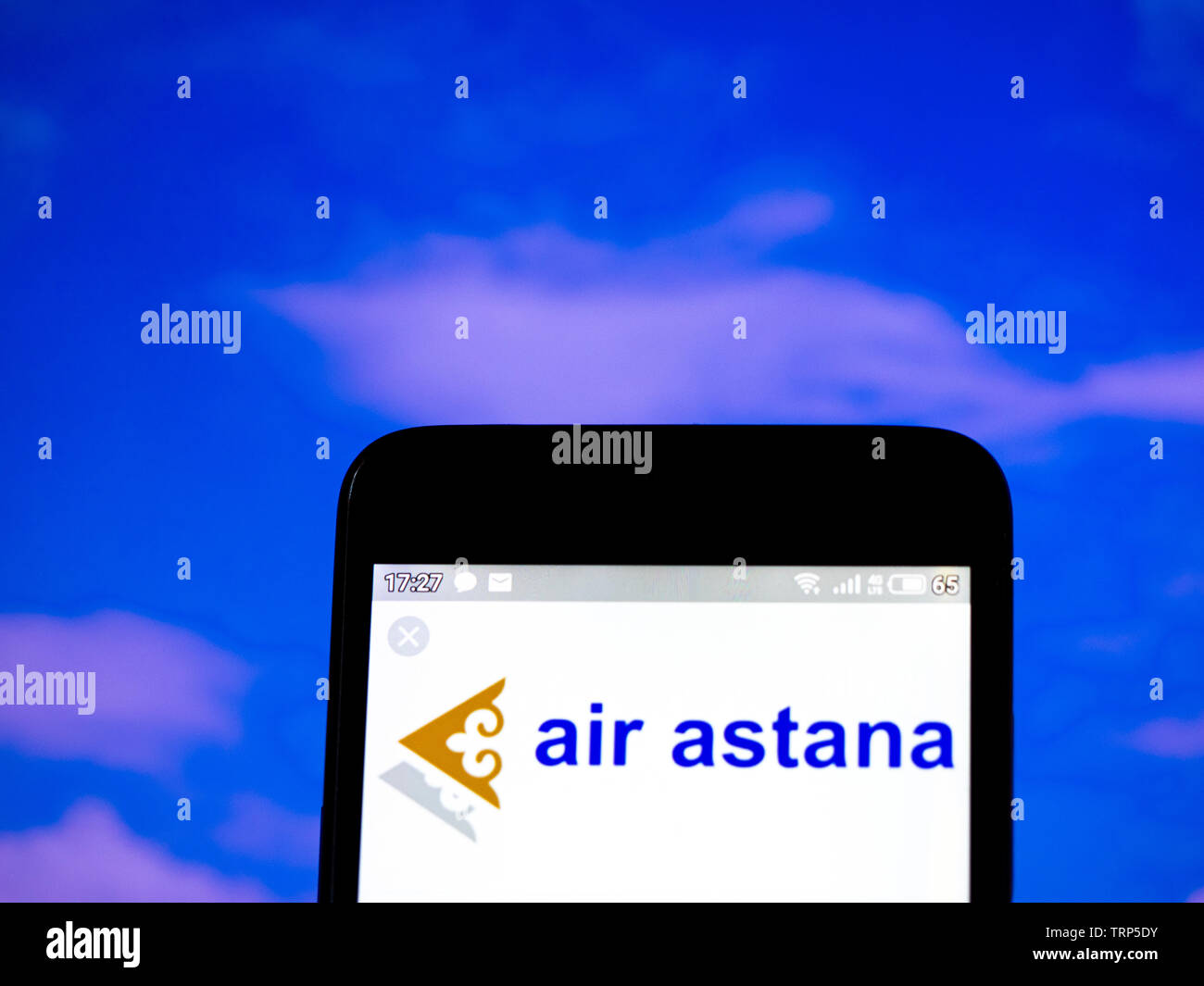 In this photo illustration the Air Astana logo is seen displayed on a ...