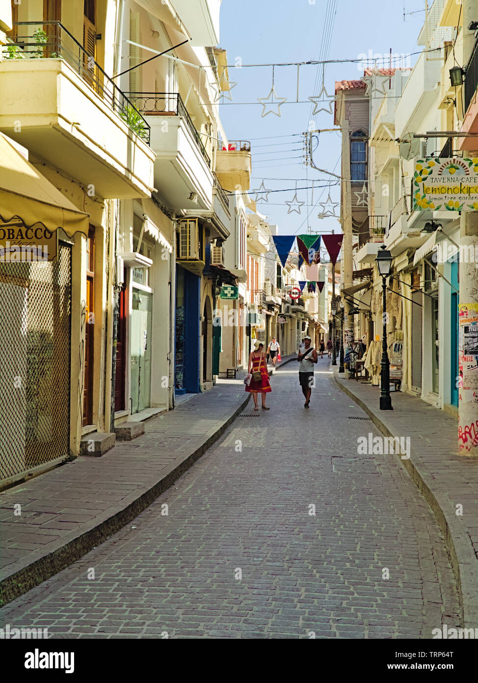 Crete, Greece - 07/26/2009: Tourist couple on stone paved street with ...
