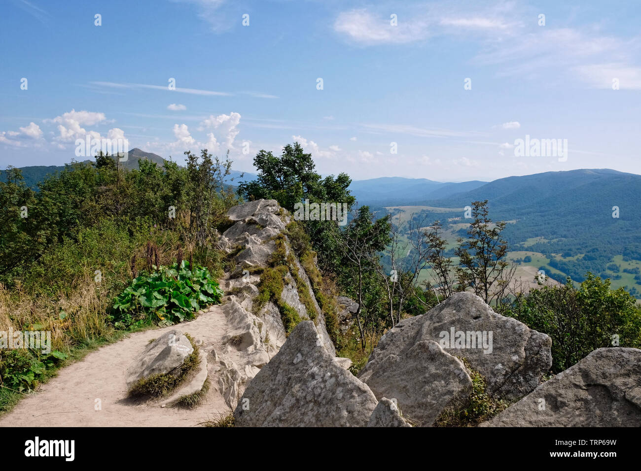 Mountain footpath view landscape from hill over blue sky background ...