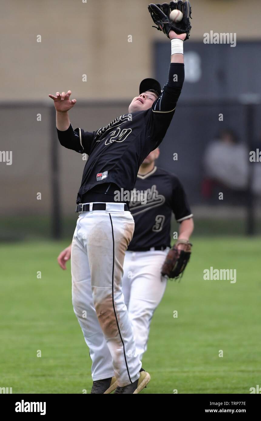 Shortstop ranging into shallow left field to make a running catch of a ...